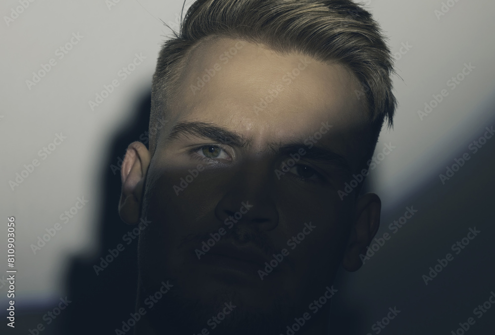 Serious, man and face with shadows in portrait and secret for mystery ...