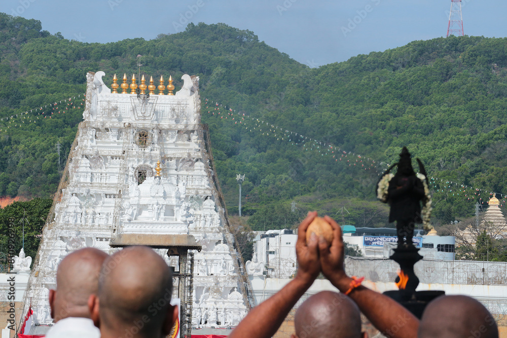 Gopuram of Balaji Temple, Garuda and pilgrims at Tirumala in Tirupati ...