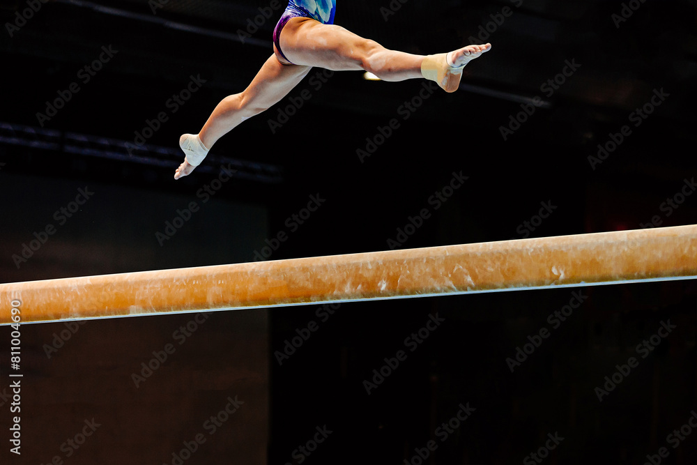legs woman exercise split jump on balance beam gymnastics in black ...