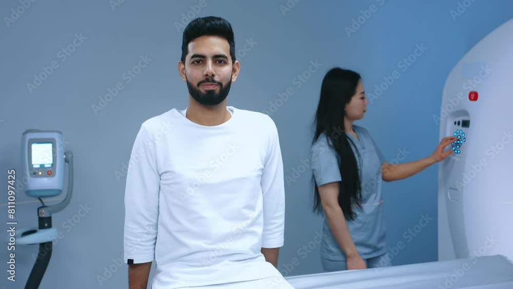 Indian patient undergoing magnetic resonance tomography. Patient ...