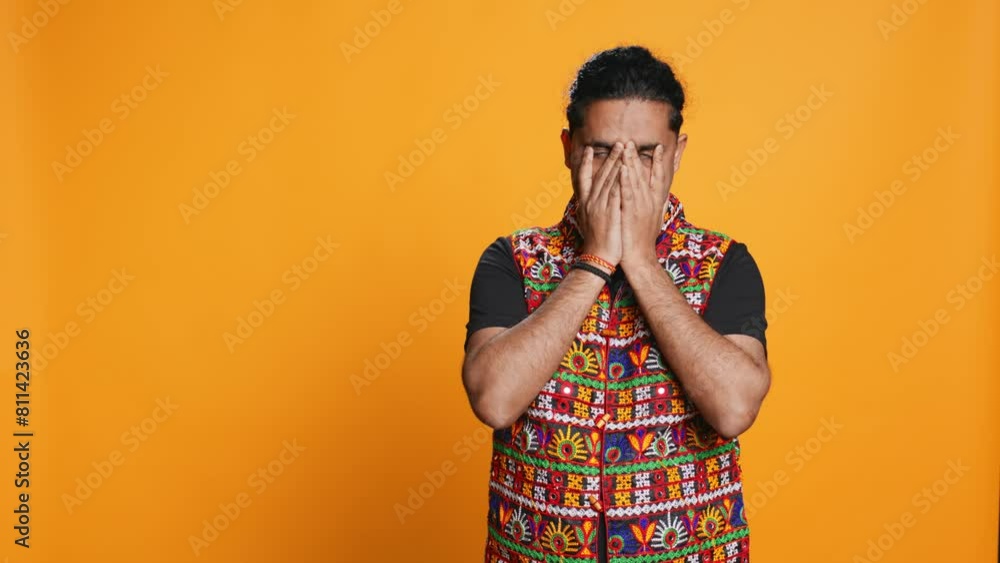 Anxious indian man covering face with palms, worried about future ...