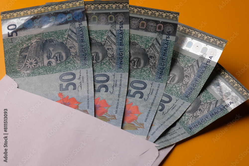 fifty Malaysian ringgit notes in an envelope. economic concept. RM ...