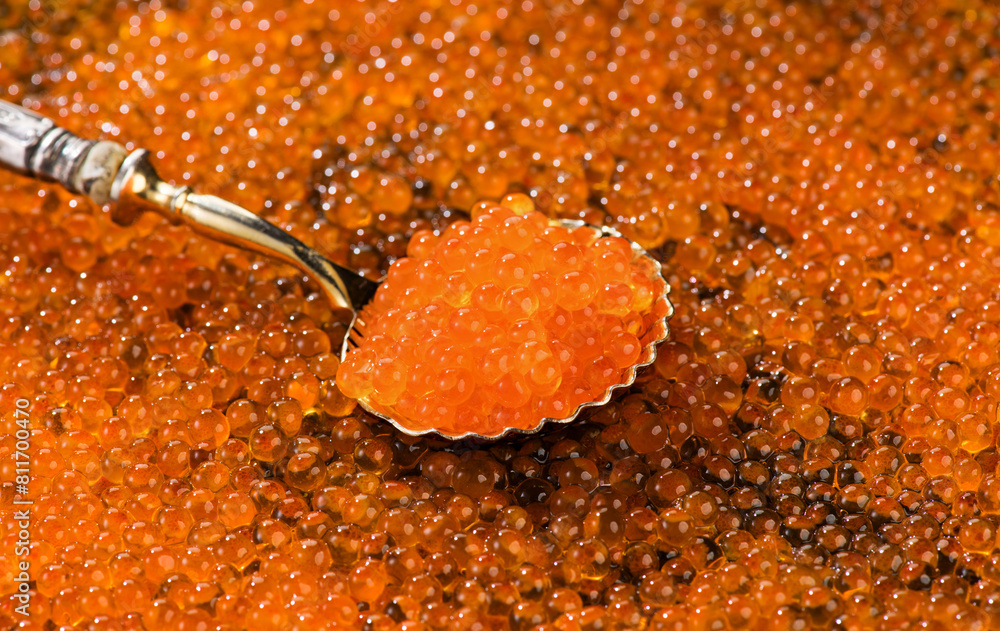 Red Caviar in a spoon. Caviar background. Fish roe, Close-up salmon or ...