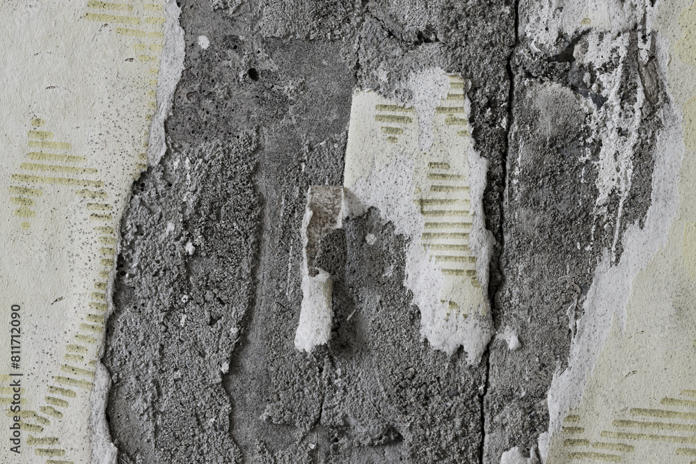 Torn old faded paper wallpaper with a retro pattern. Tattered scraps of ...