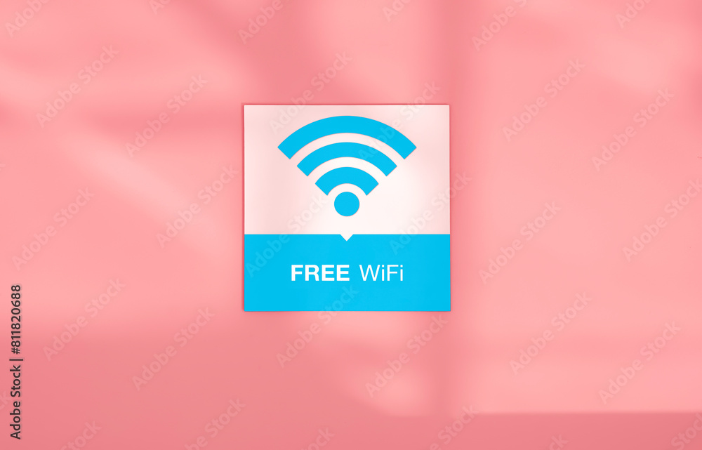 Free wifi sign label on interior pastel pink smartboard wall background ...