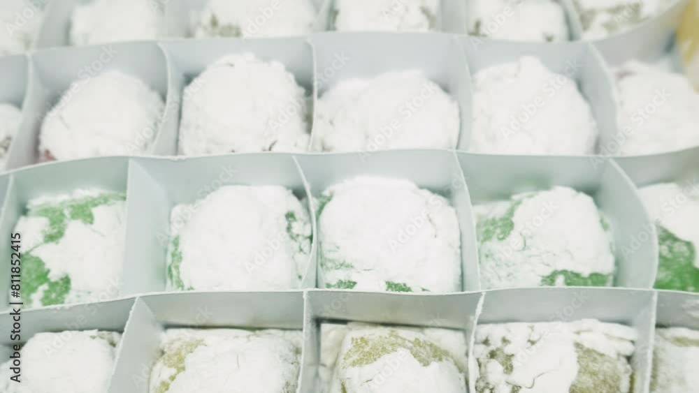 Mochi variants of various colors and flavors such as Pandan, Chocolate ...