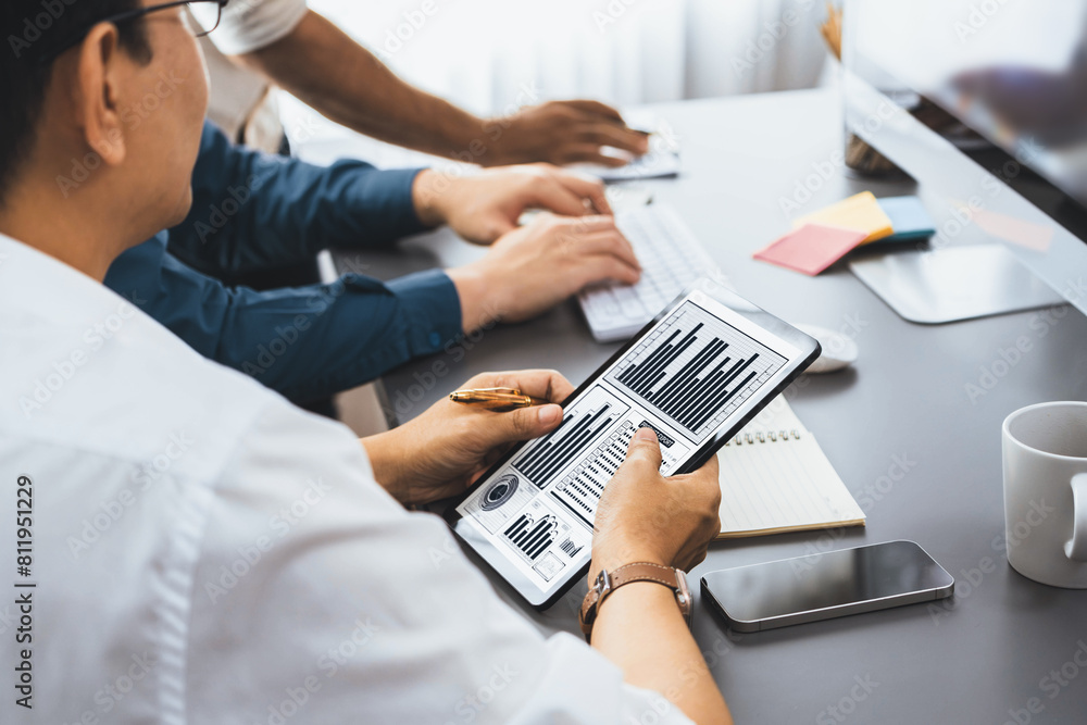 Data analysts team of office worker collaborate on business intelligence BI dashboard to analyze ...