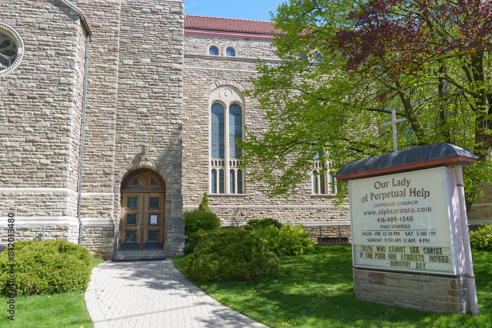 outdoor sign and side entrance to Our Lady of Perpetual Help located at 78 Clifton Road in ...