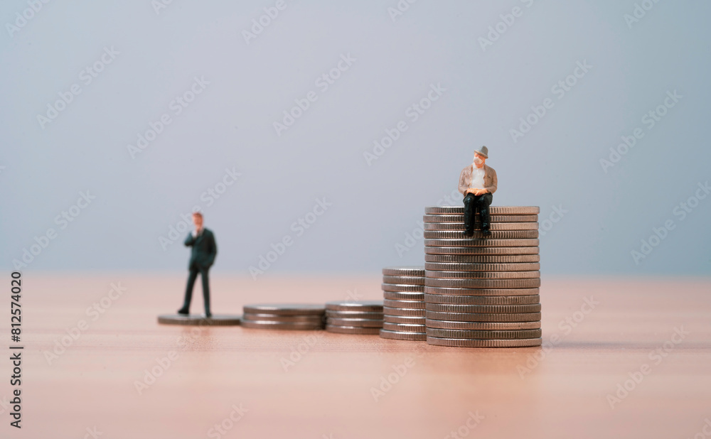 Miniature figure young man standing and Senior Pensioners old man sit ...