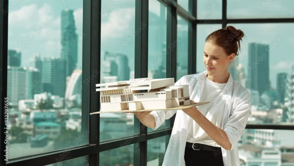 Smart happy beautiful manager check house model by turning left side ...