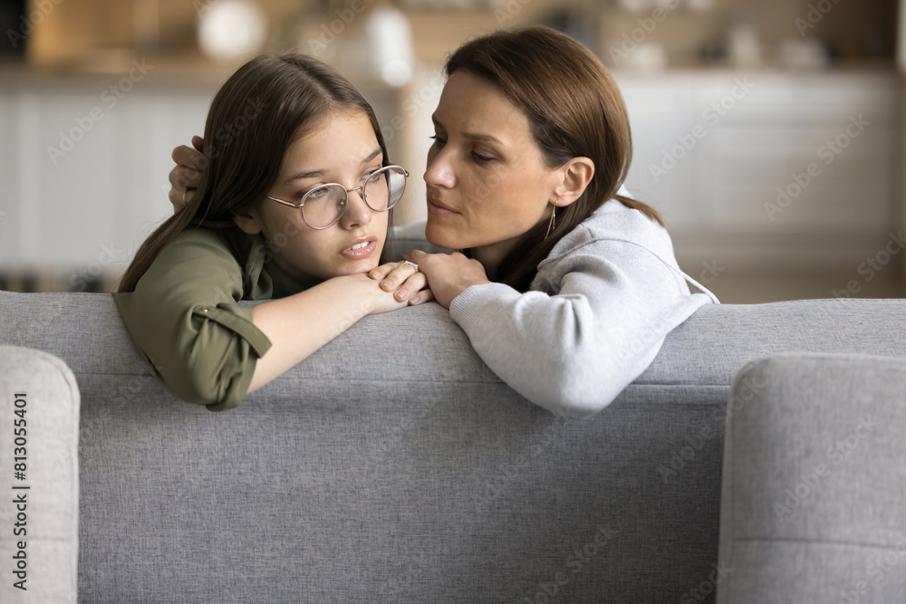 Serious empathetic mom listening to sad frustrated teenage daughter kid ...