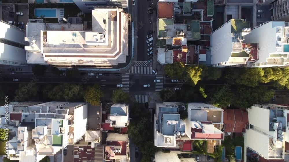 Cars passing through intersection with road safety paint, traffic ...