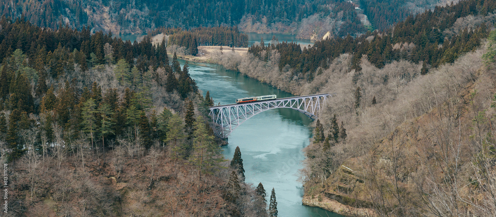Panoramic View of Japan local train with Tadami river and bridge ...