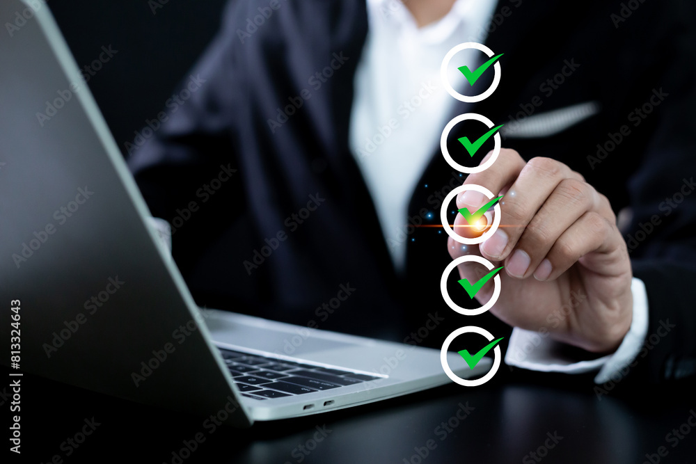 Checklist concept Businessman surveying online checklist on virtual ...