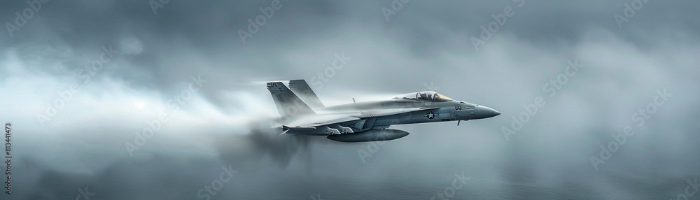 Against a backdrop of gray clouds, a military fighter jet zooms through ...