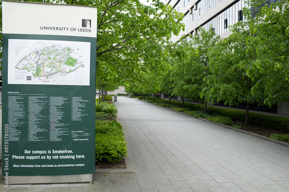 University Of Leeds campus map sign besides tree line pavement. Leeds ...