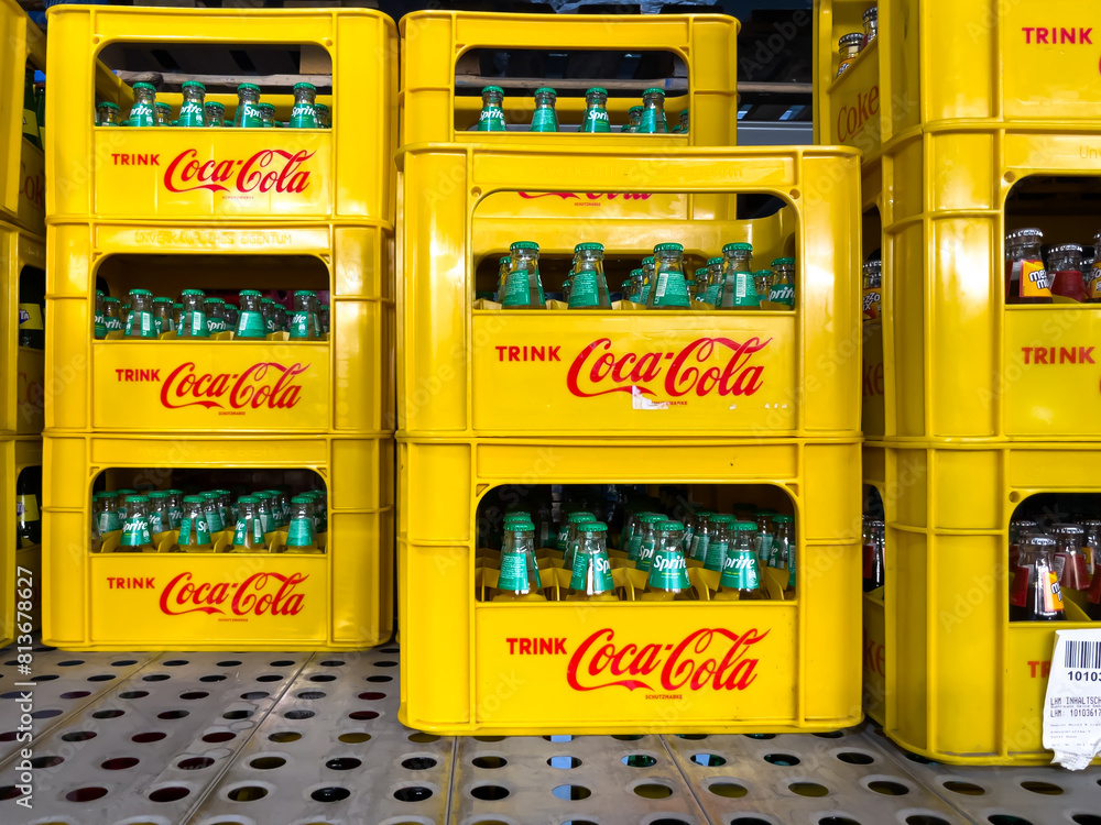 Germany Berlin May 11, 2024. A stack of yellow Coca-Cola crates. The ...