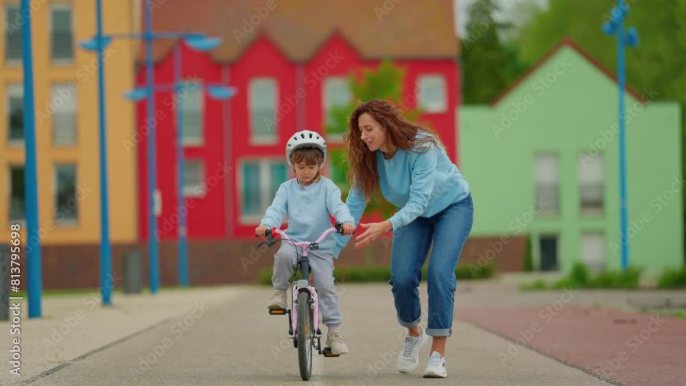 Mother teaches ride bike little daughter child. daughter kid with mom ...