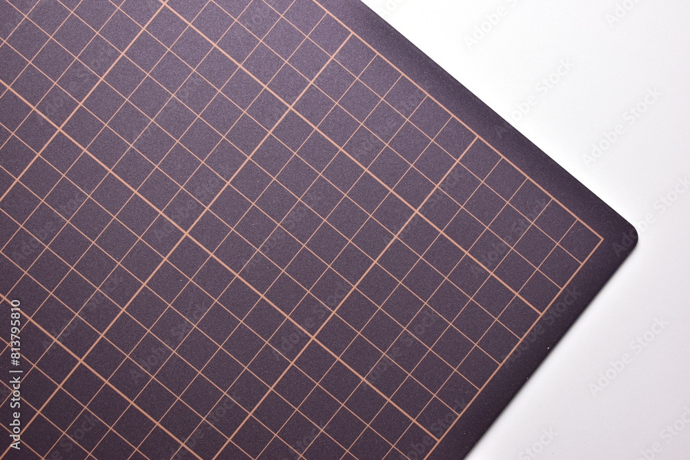 black cutting mat board on white background with line and scale measure ...