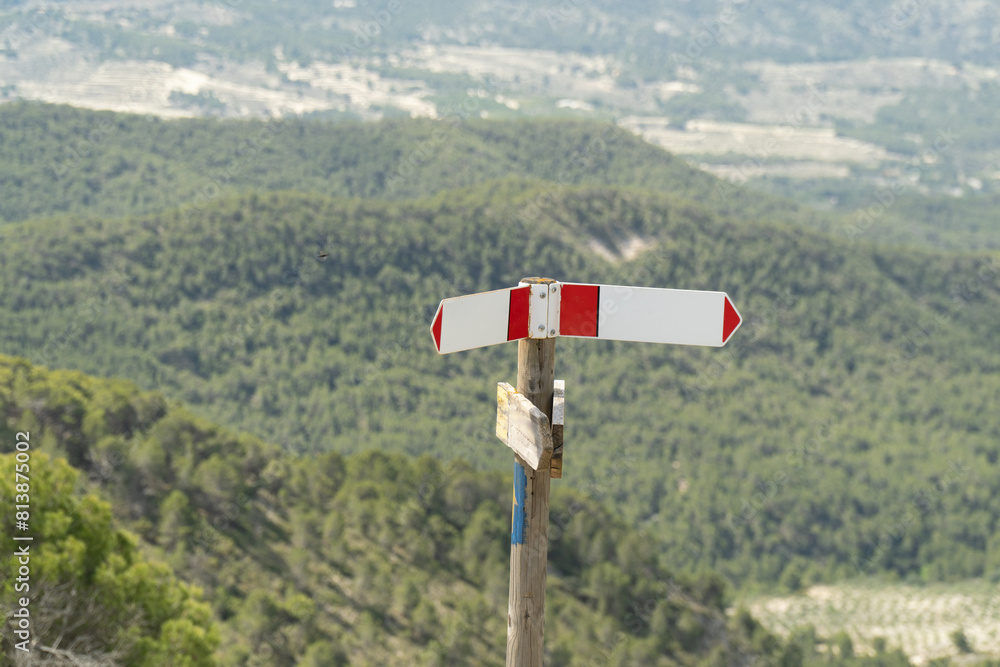 Signpost with arrows outdoors, landmarks for directions, waypoint ...