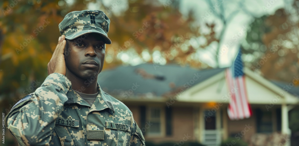 male in military uniform saluting standing outside of a house with an ...