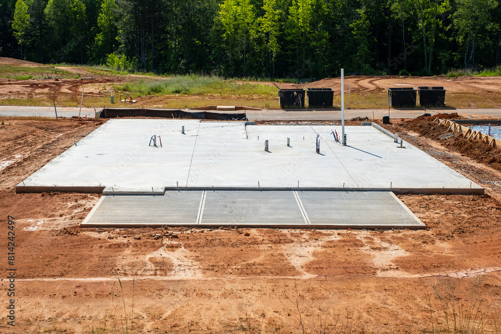 Slab-on-grade foundation with plumbing prep for residential house ...