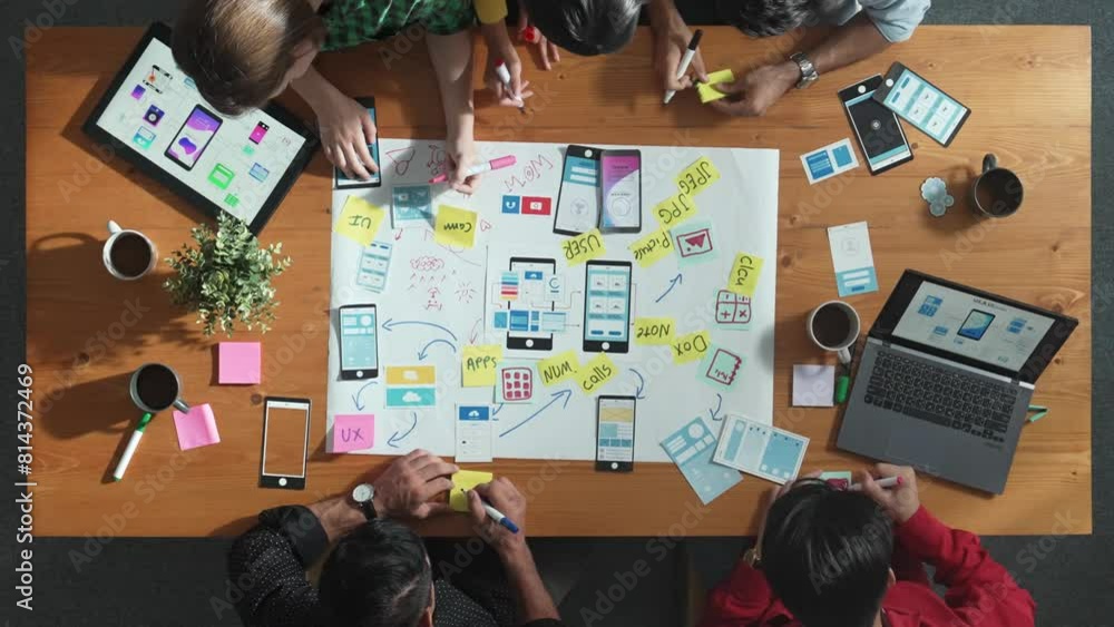 Professional developer team sharing idea of Ux Ui design by using mind map. Top down view of ...