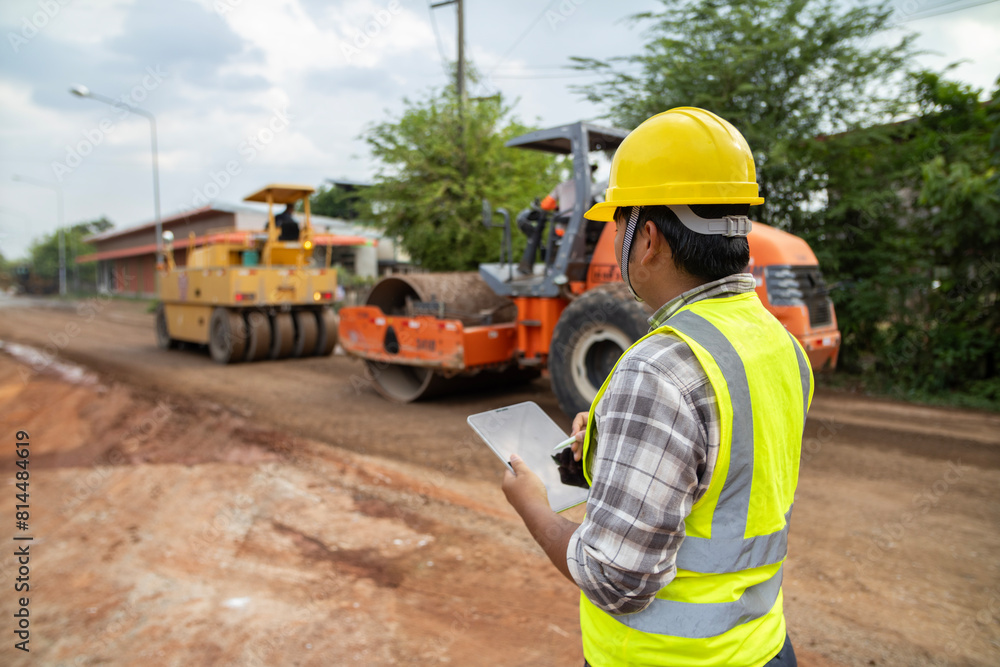 Road construction inspector Standing and inspecting work at the ...
