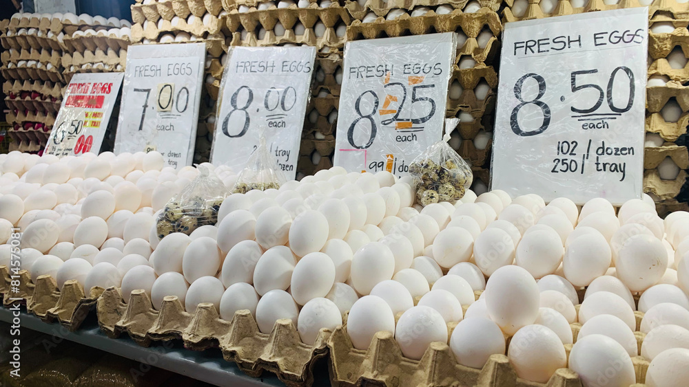 A display of fresh eggs for sale with a Philippine pesos price tag on ...