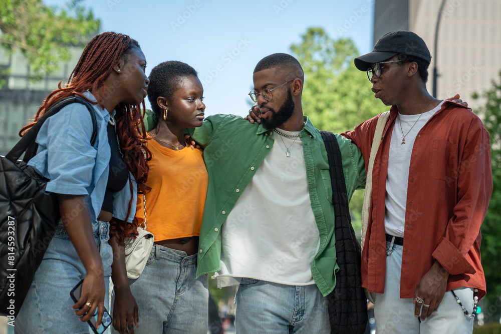 Relaxed African American guy enthusiastically shares interesting gossip ...