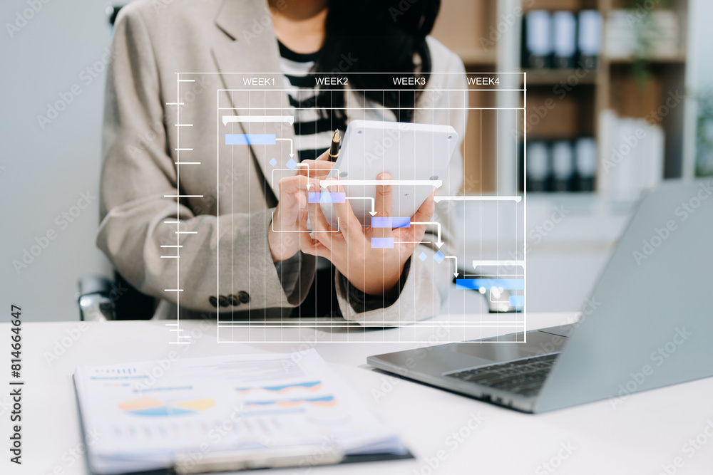 Project manager working and update tasks with milestones progress ...