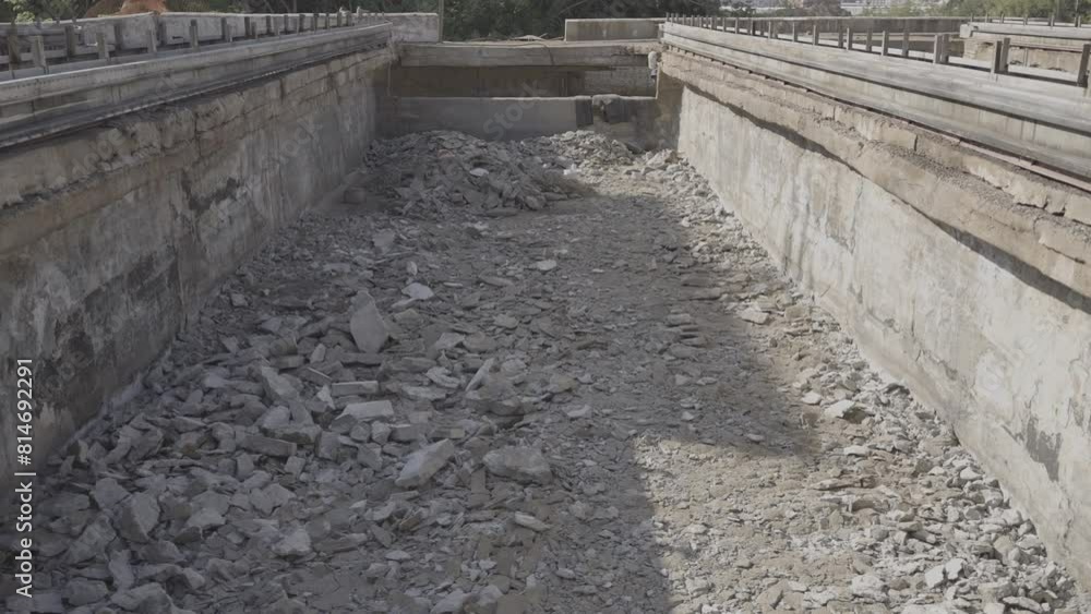 Trench with broken concrete debris at construction site. Demolished ...