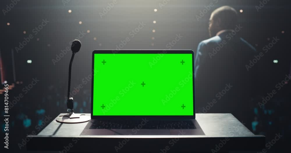 Presentation at a Corporate Conference with a Speaker in the Background ...