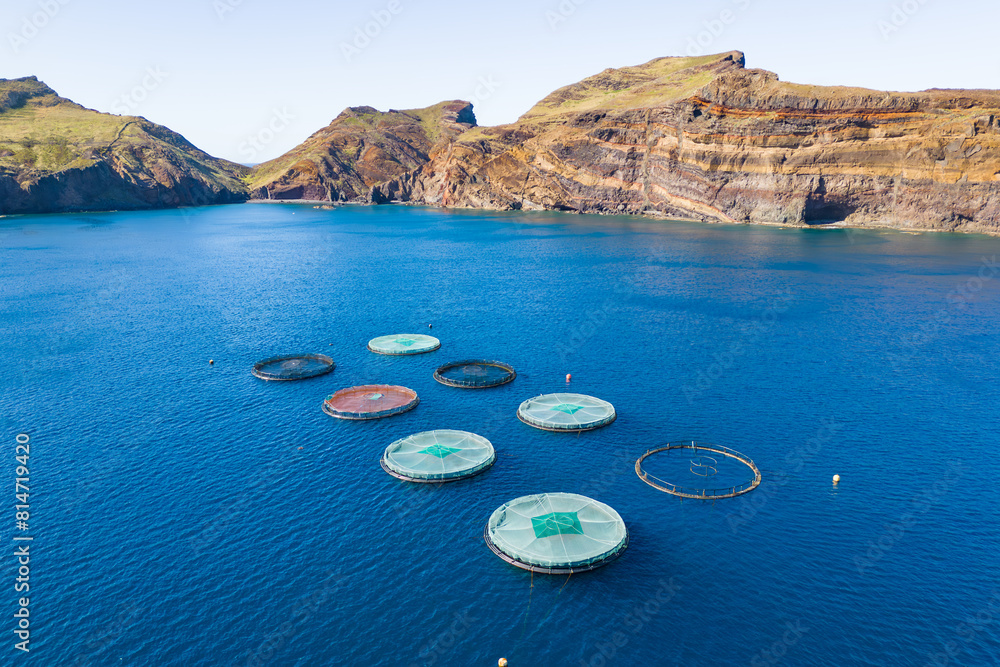 Aquaculture farming, fish growing cages in Atlantic ocean on Madeira ...