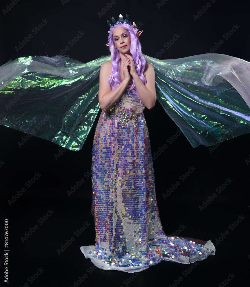 Full length portrait of beautiful female model with long purple hair ...