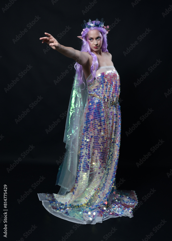 Full length portrait of beautiful female model with long purple hair ...