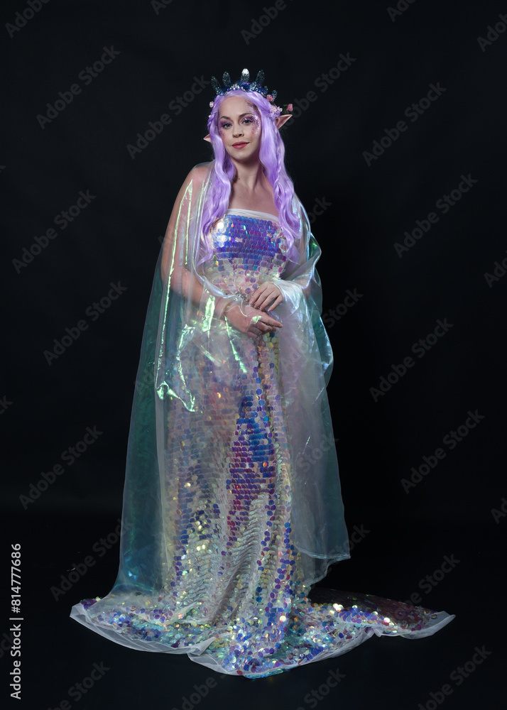 Full length portrait of beautiful female model with long purple hair ...