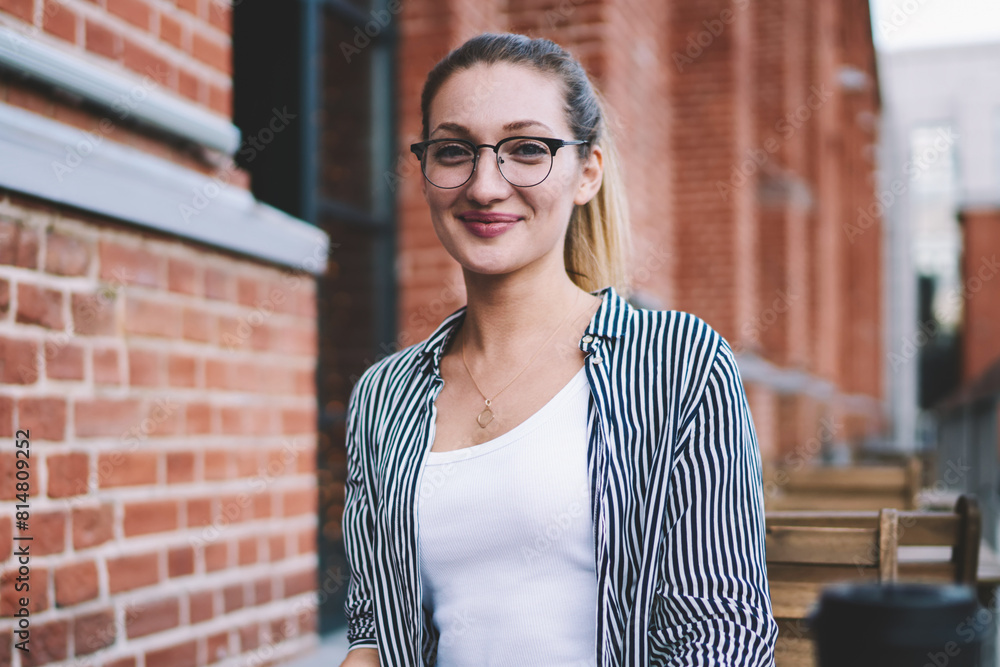 Portrait of successful female software developer looking at camera in ...