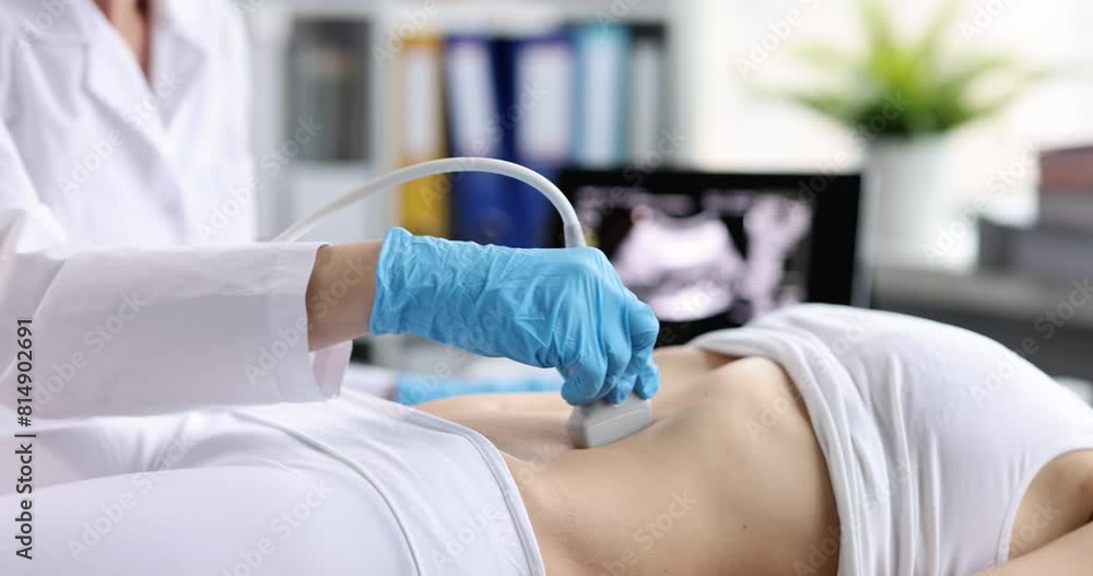 Ultrasound diagnosis of stomach on abdominal cavity of woman in clinic ...