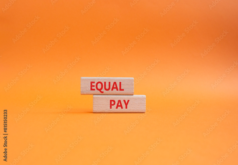 Equal Pay symbol. Wooden blocks with words Equal Pay. Beautiful orange ...