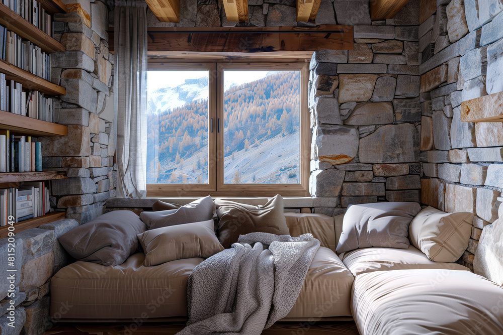 Corner sofa against window in room with stone cladding walls. Farmhouse ...