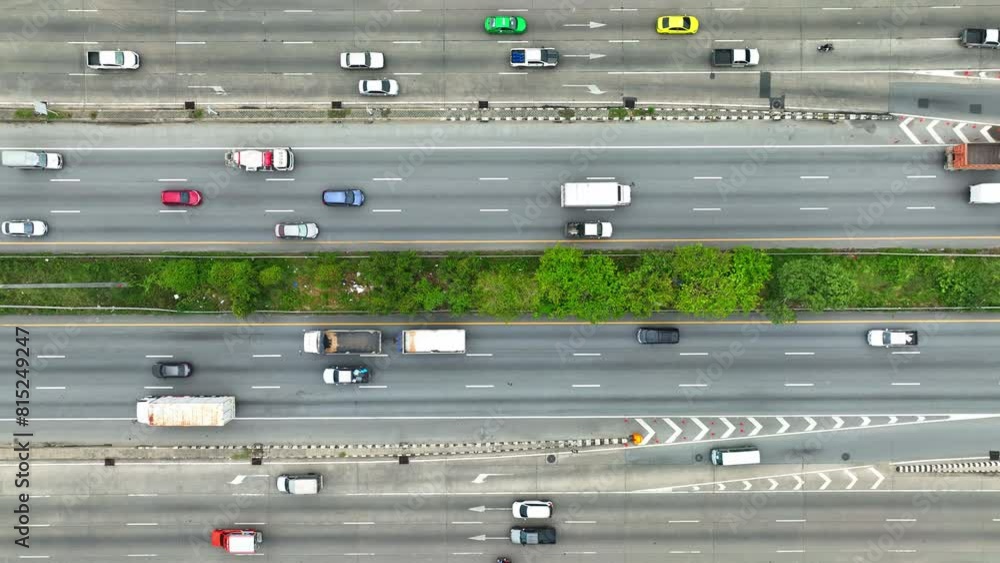 Observing from above, the multi-lane road showcases orderly traffic ...