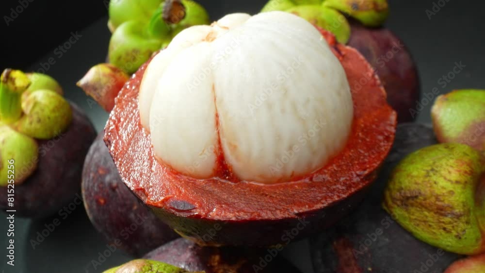 Mangosteen, the "queen of fruits," boasts a regal purple rind enfolding ...