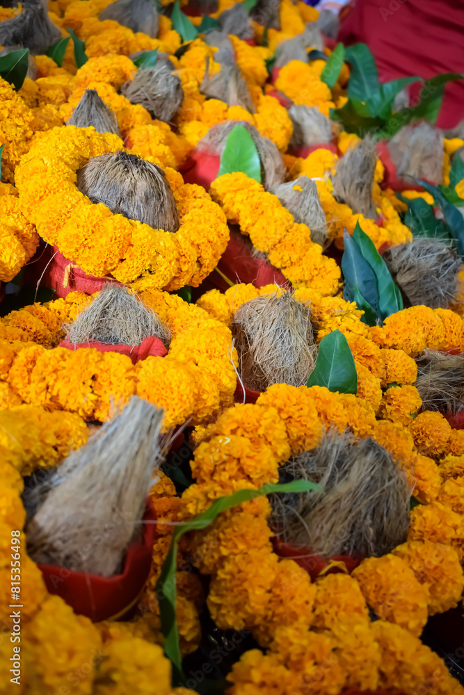 Kalash with coconut and mango leaf with floral decoration earthen pots ...