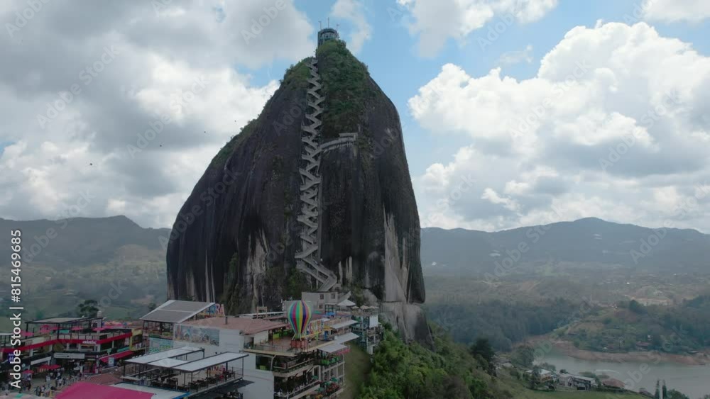 Aerial shot of El Peñón de Guatapé, a large, unique rock standing alone ...