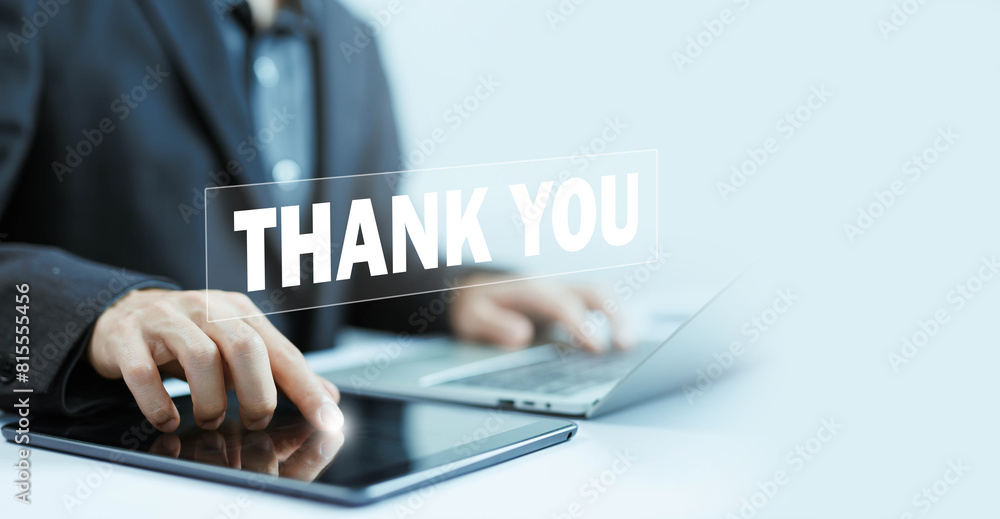 thank you business. businessman using a laptop and showing the message ...