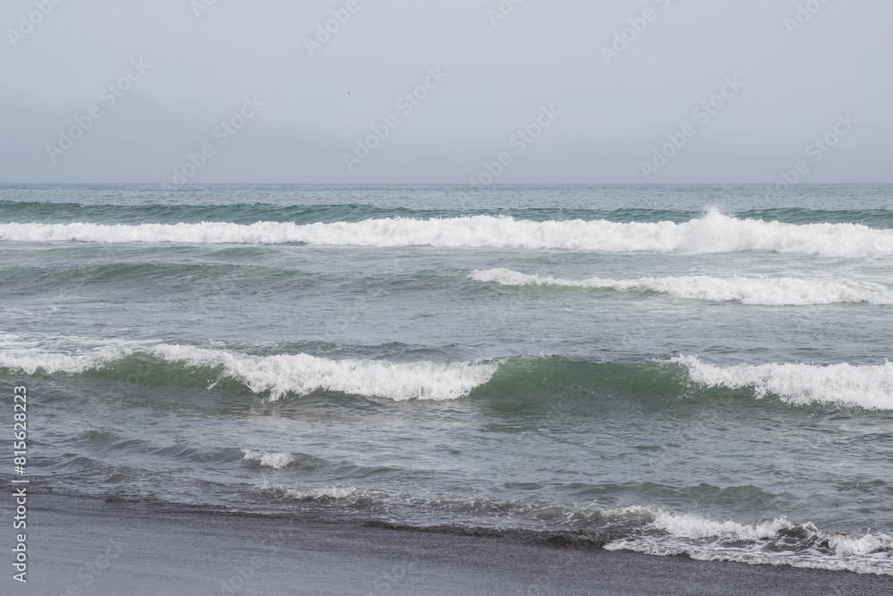 Seascape. View of the waves and surf. Windy weather. Waves, foam and ...