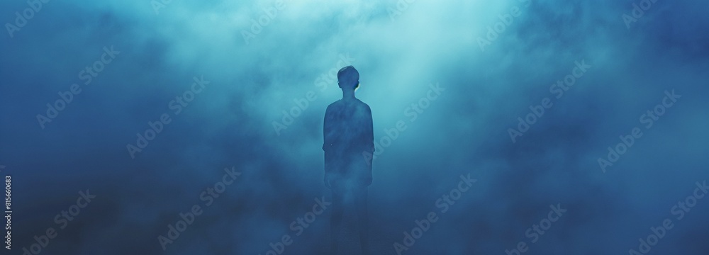 This eerie picture depicts a person covered in blue mist, signifying ...