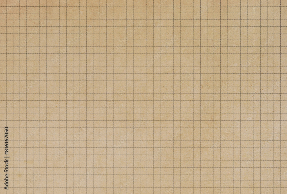 A sheet of old brown math grid paper, graph paper texture as background ...