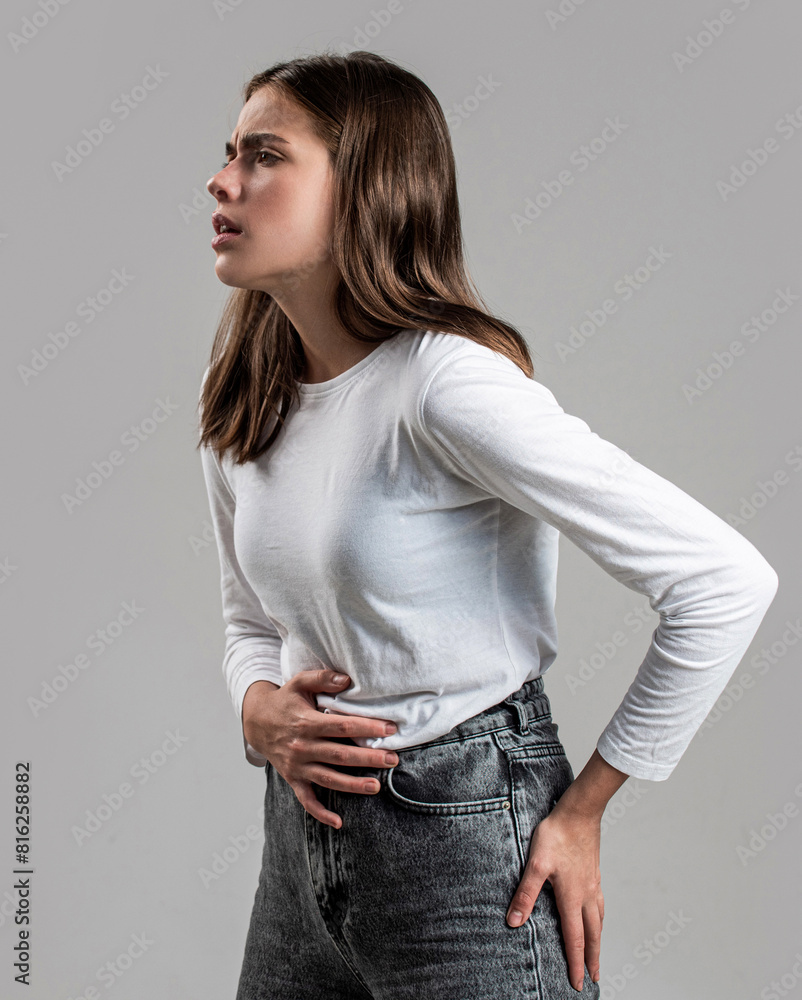 Woman with hand on stomach because nausea, painful disease feeling ...